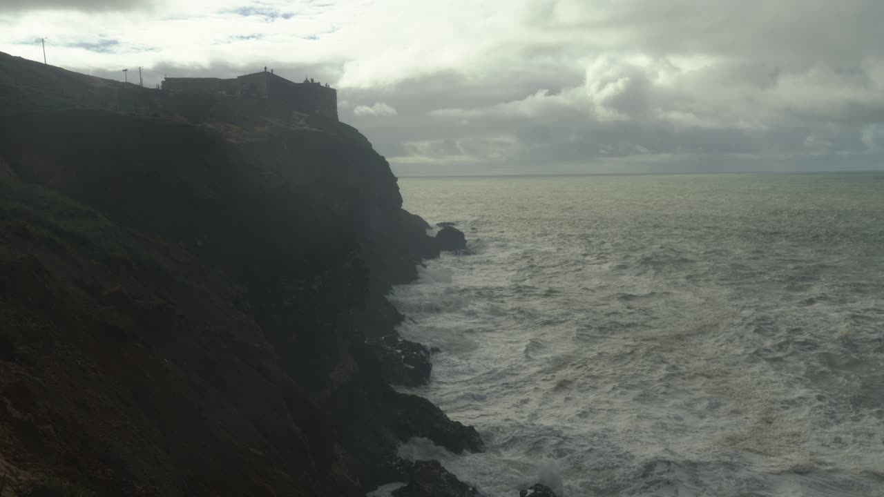 Stormy Ocean Or Sea And Rock Cliffs In Nazare, Portugal, Bad Cloudy ...