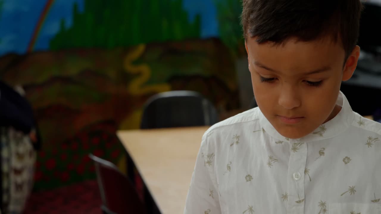 Premium stock video - Front view of asian schoolboy playing xylophone ...
